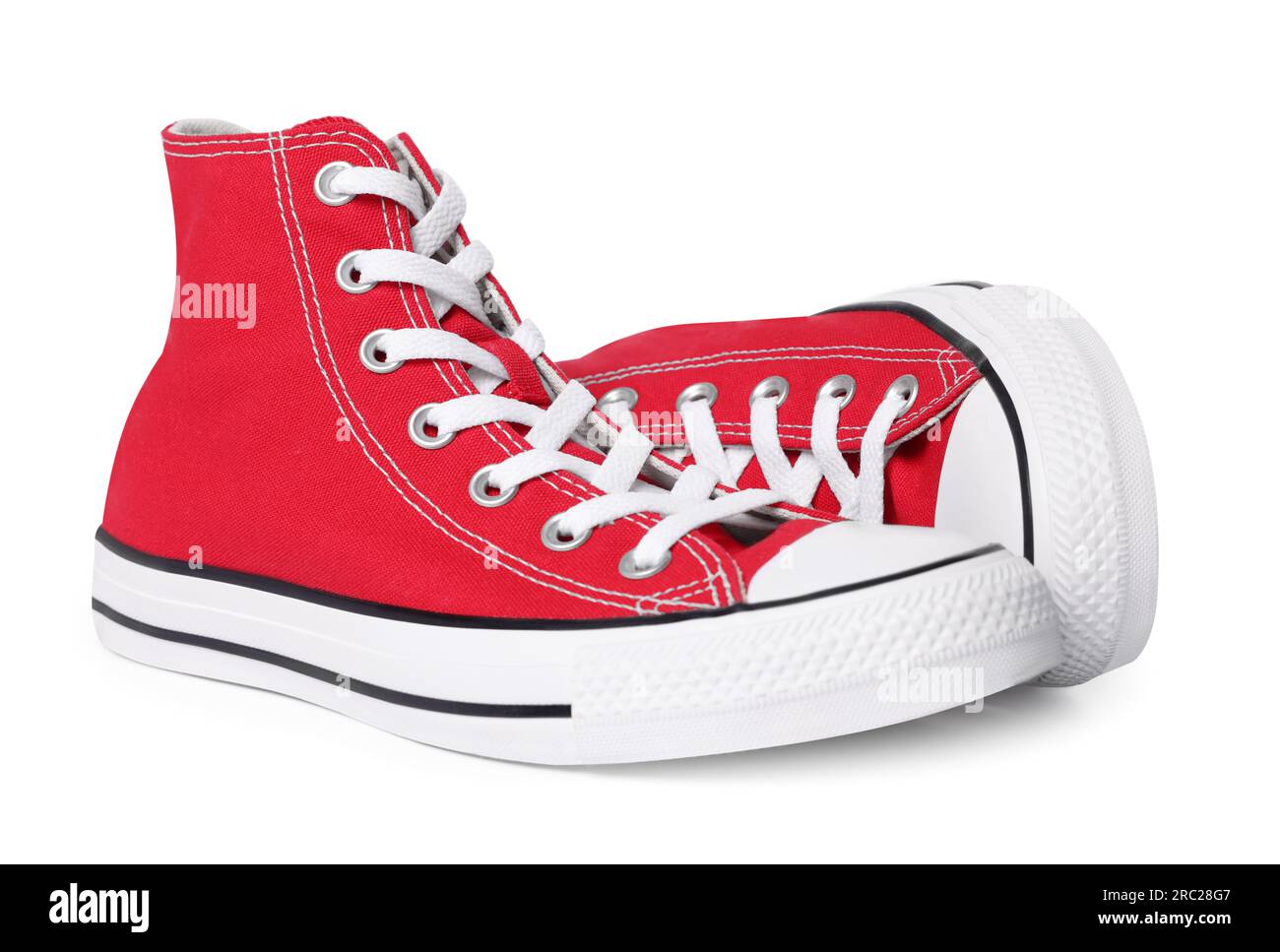 Pair of new red stylish high top plimsolls on white background Stock ...