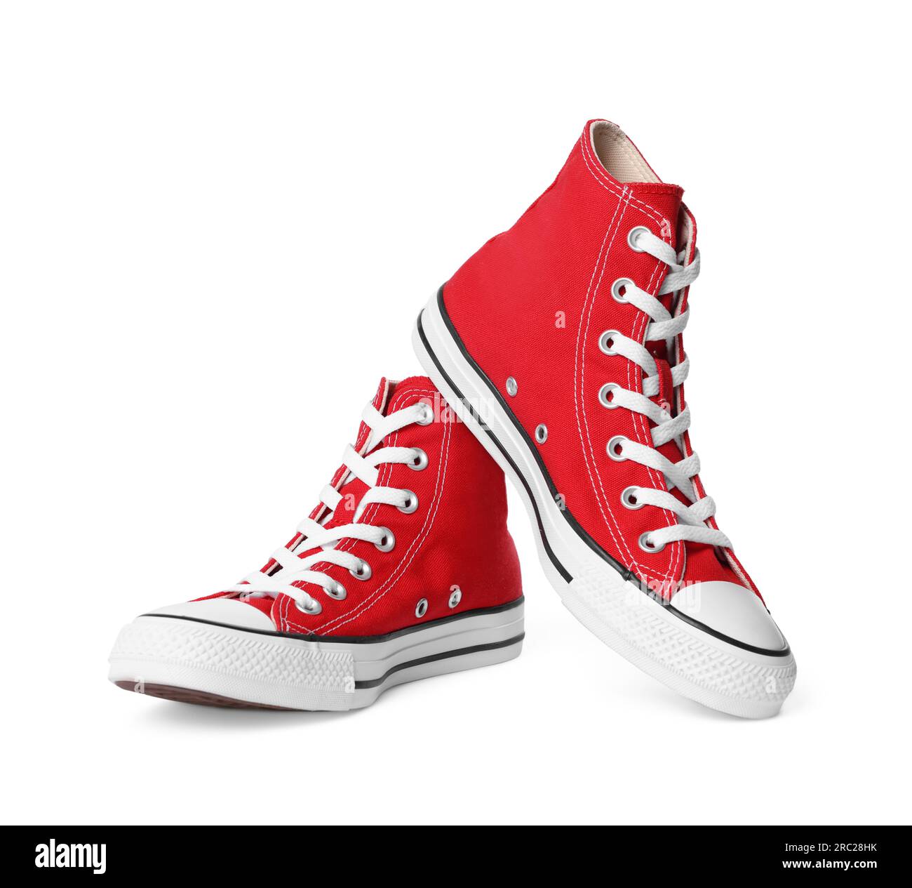 Pair of new red stylish high top plimsolls on white background Stock ...