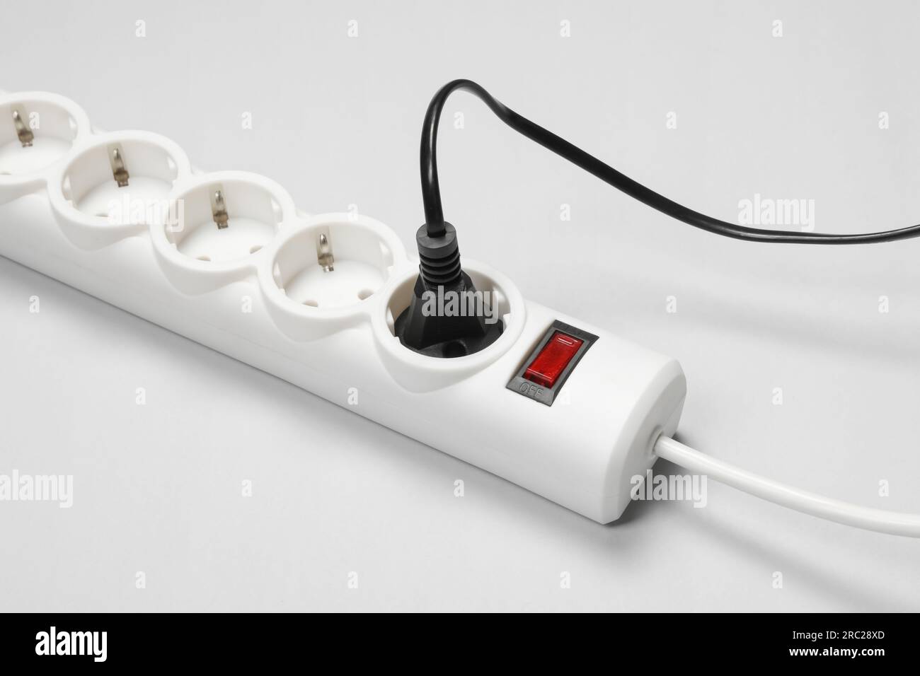 Power strip with electrical plug on white background, closeup Stock ...