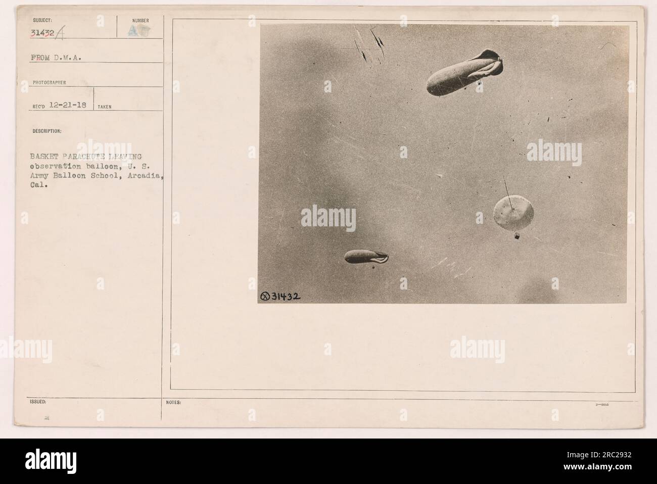 "American soldier descends to the ground in a parachute after leaving ...