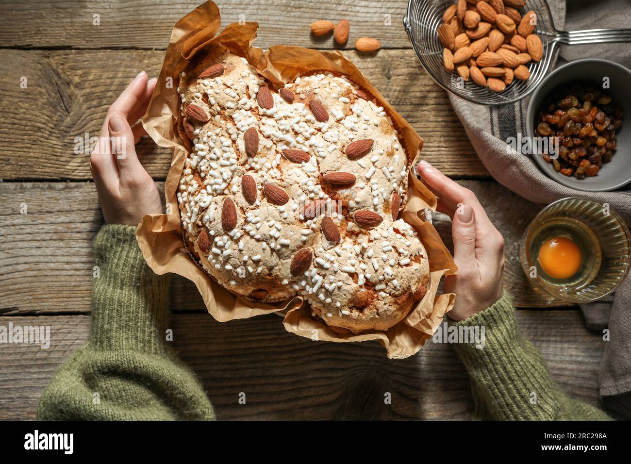 Woman with delicious Italian Easter dove cake (traditional Colomba di ...