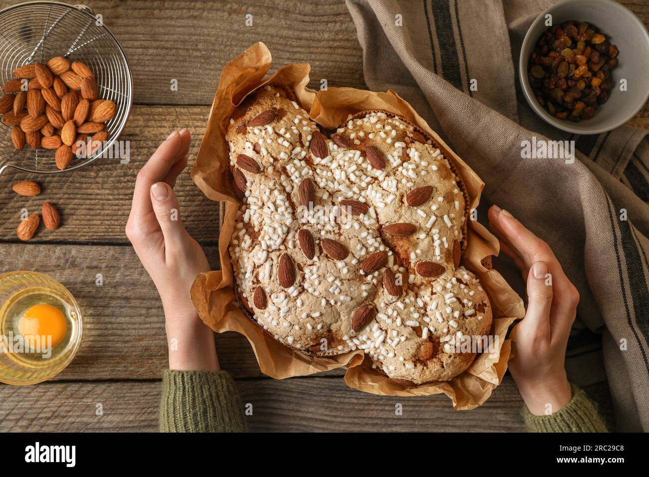 Woman with delicious Italian Easter dove cake (traditional Colomba di ...
