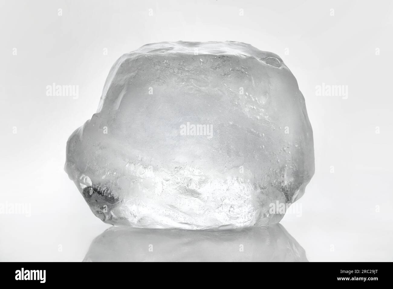 One crystal clear ice cube isolated on white Stock Photo - Alamy