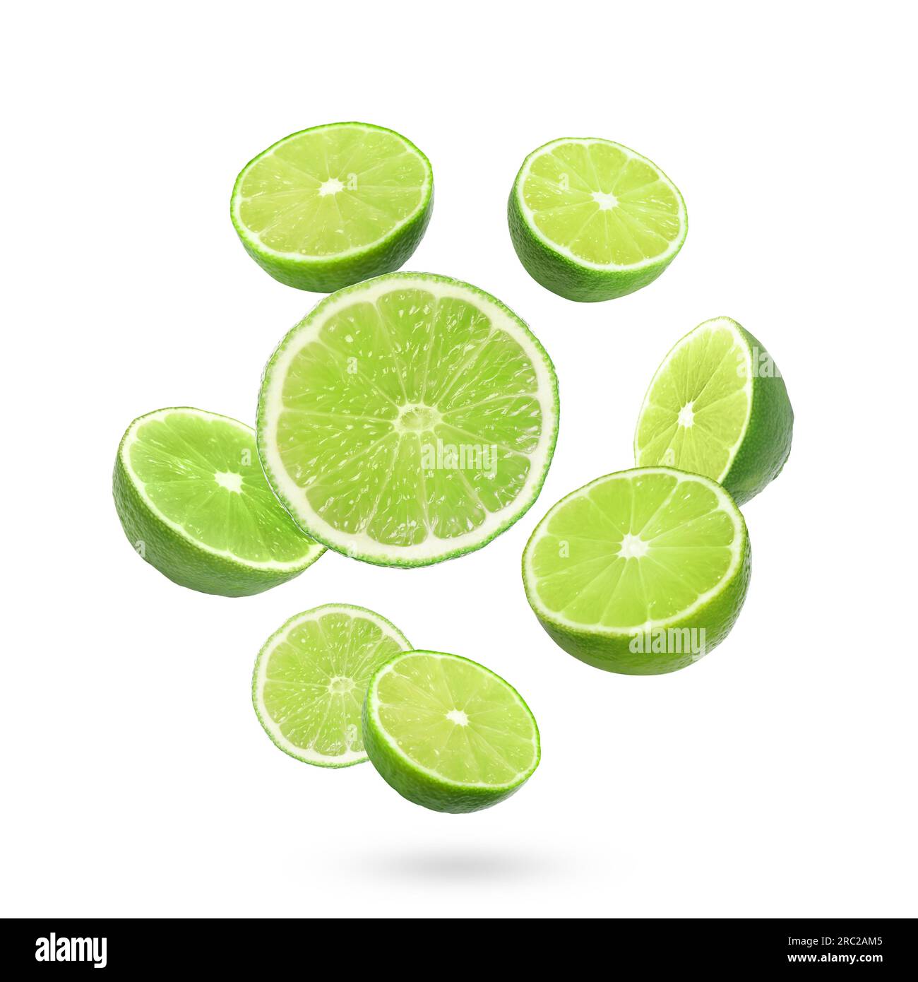 Fresh lime fruits falling on white background Stock Photo - Alamy