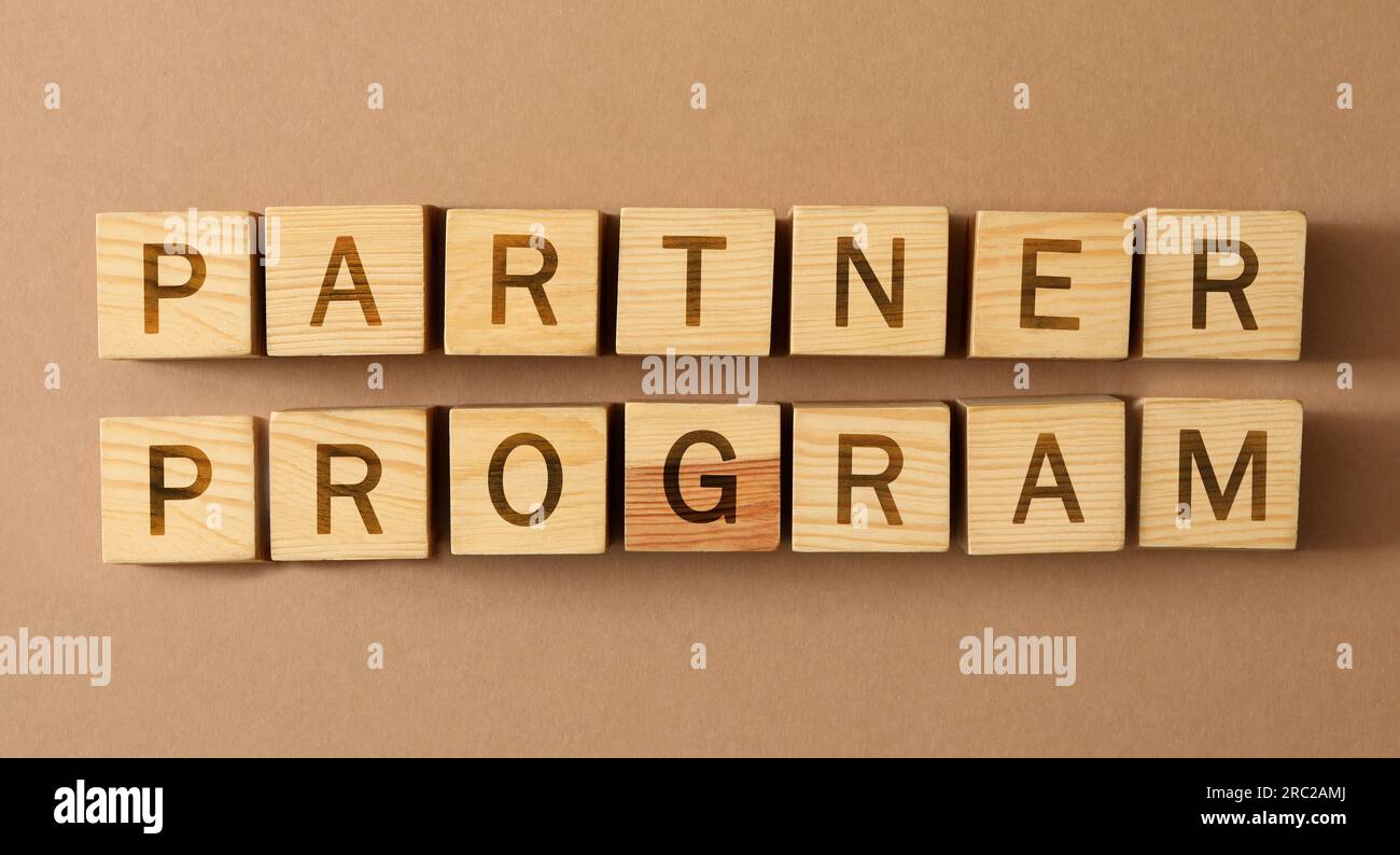 Words Partner Program made of wooden cubes with letters on beige ...