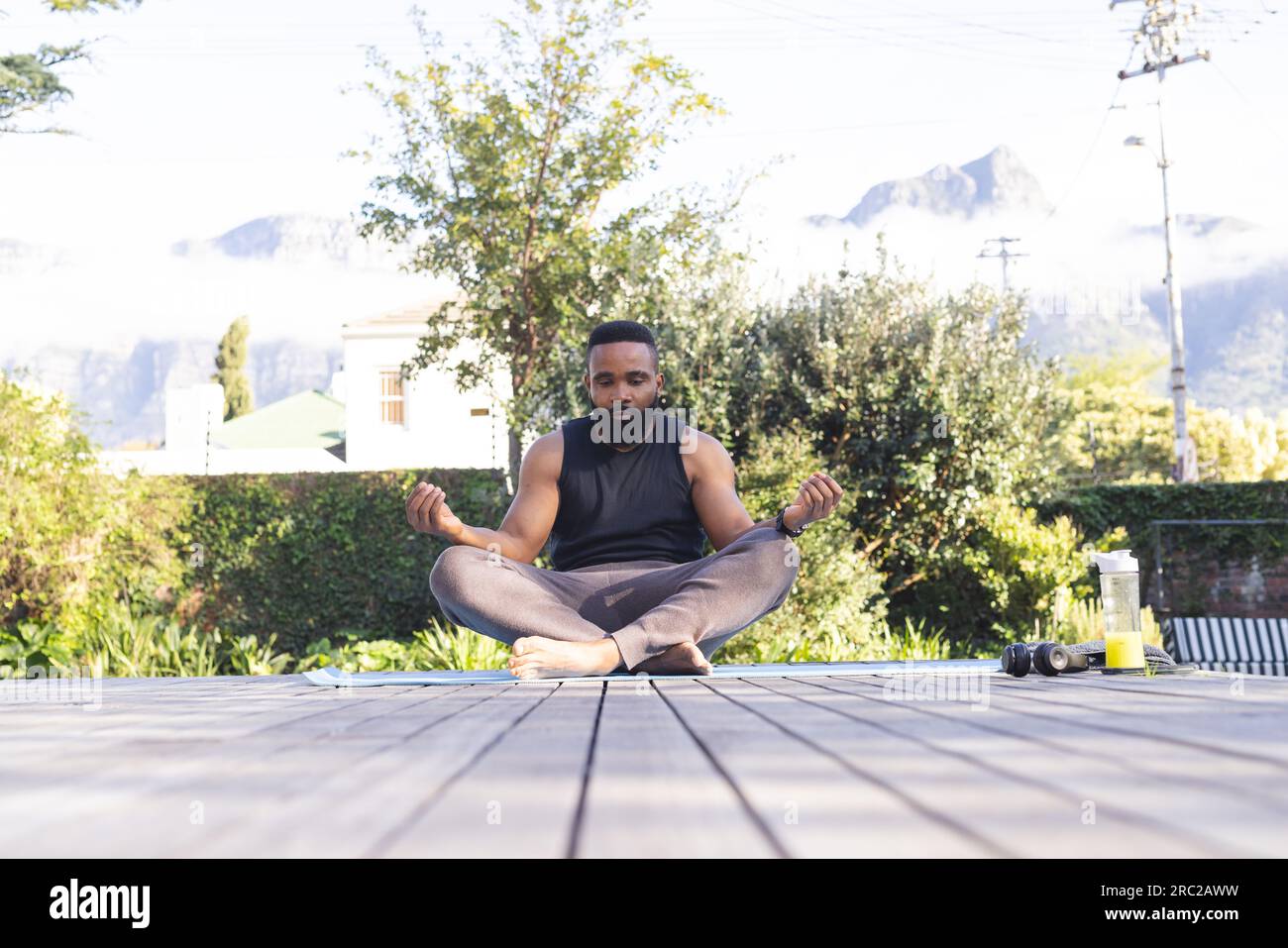 Man meditating on mat in hi-res stock photography and images - Alamy