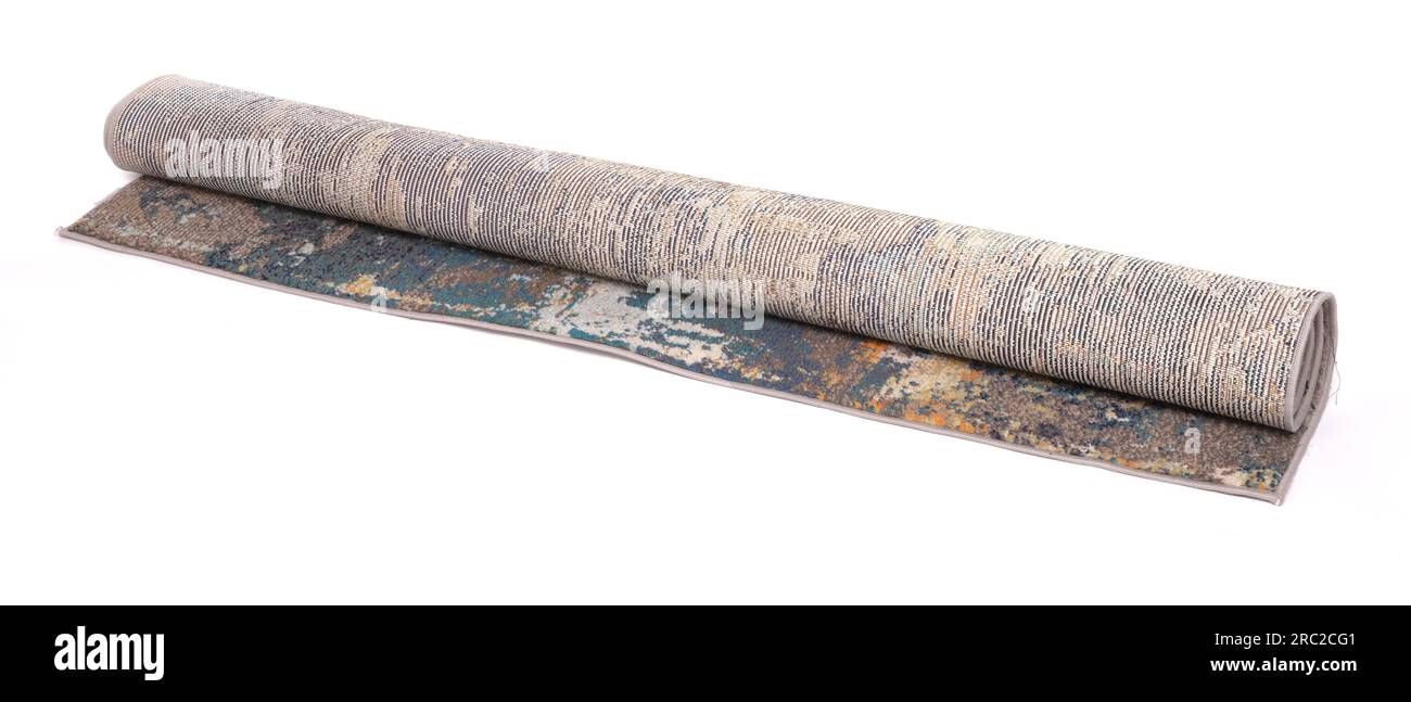 Rolled up carpet isolated on a white background Stock Photo - Alamy