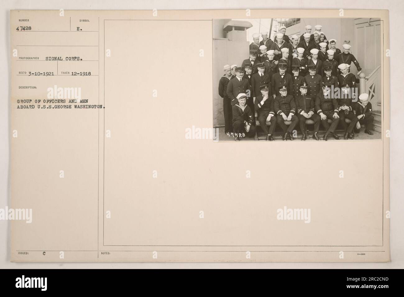 Officers and enlisted men gathered on the deck of the U.S.S. George ...
