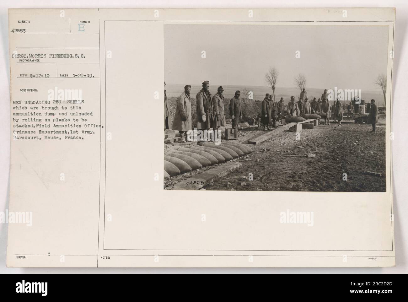 Soldiers unloading and stacking 280 shells at a field ammunition office ...