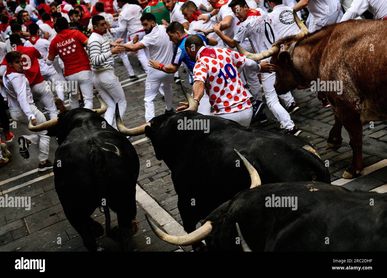 Pamplona, northern Spain, on July 12, 2023.Participants run with bulls ...