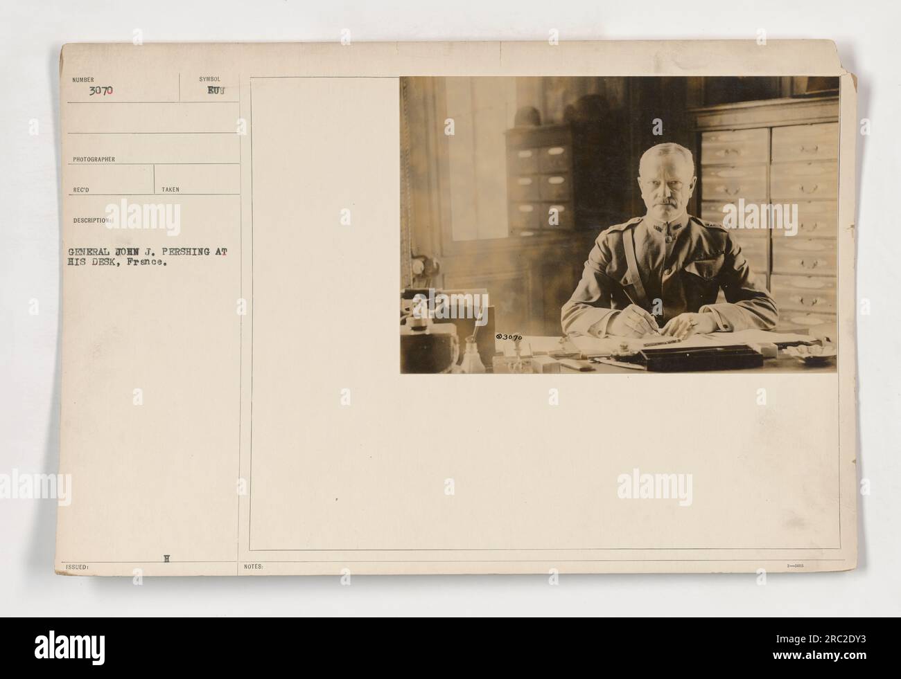 General John J. Pershing pictured sitting at his desk in France during ...