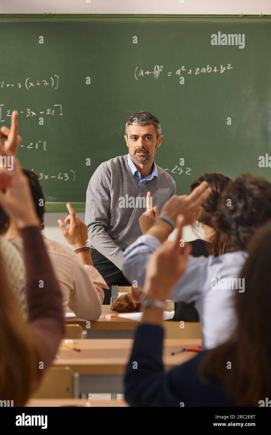 Math teacher giving lessons. Classroom with students. School education ...