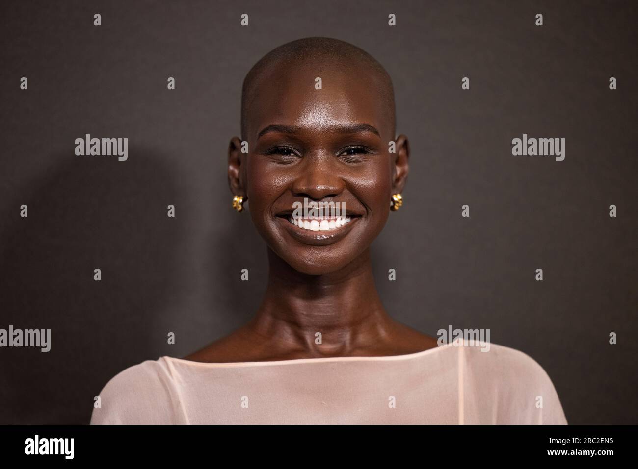 Adot Gak poses for photographers upon arrival at the premiere of the ...