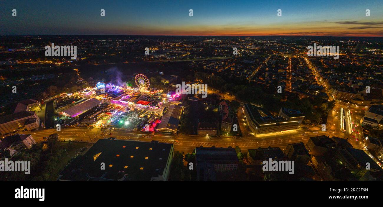 Beautiful nightfall over Augsburg and the Plärrer, biggest funfair in ...