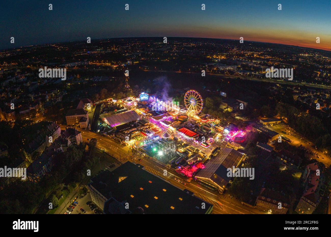 Beautiful nightfall over Augsburg and the Plärrer, biggest funfair in ...