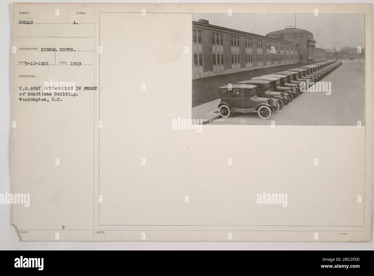 A line of U.S. Army automobiles parked in front of the Munitions ...