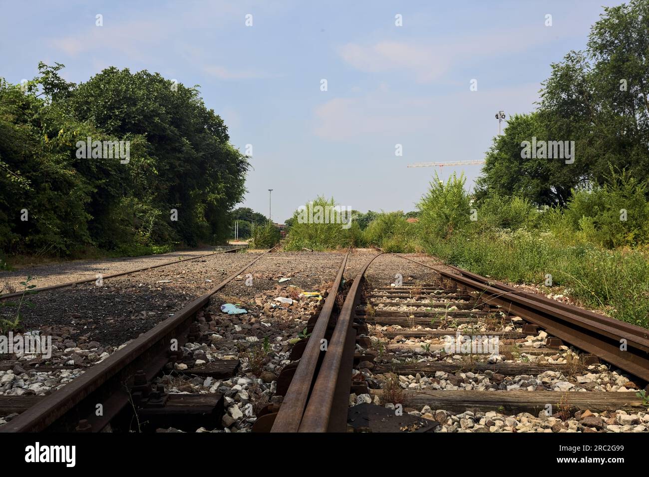 Abandoned railroad tracks next to a building in an italian town in ...