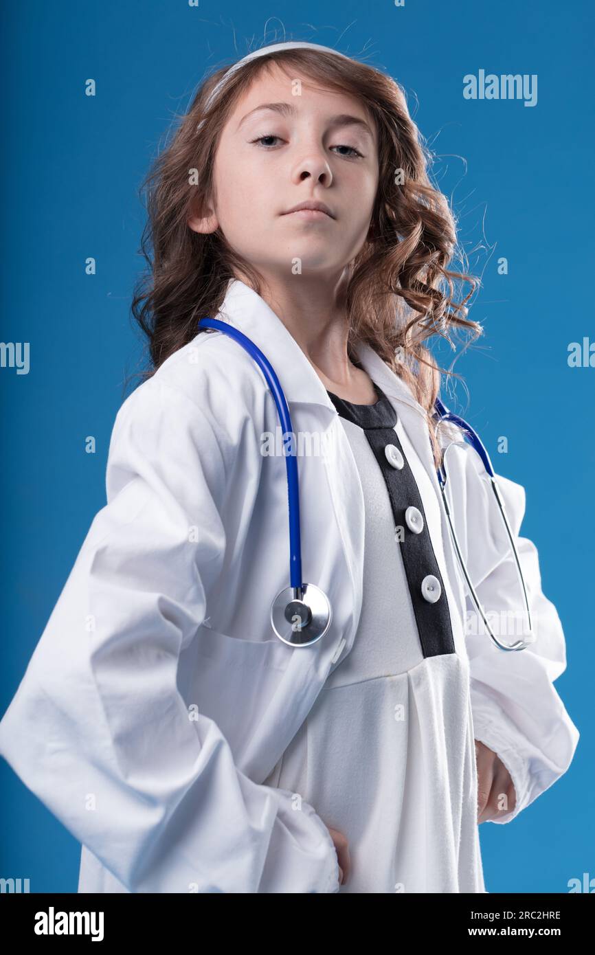 On a blue background, a girl in a doctor's outfit, with stethoscope ...