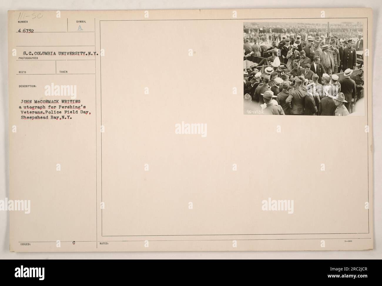 John McCormack, a famous singer, writes autographs for veterans of ...