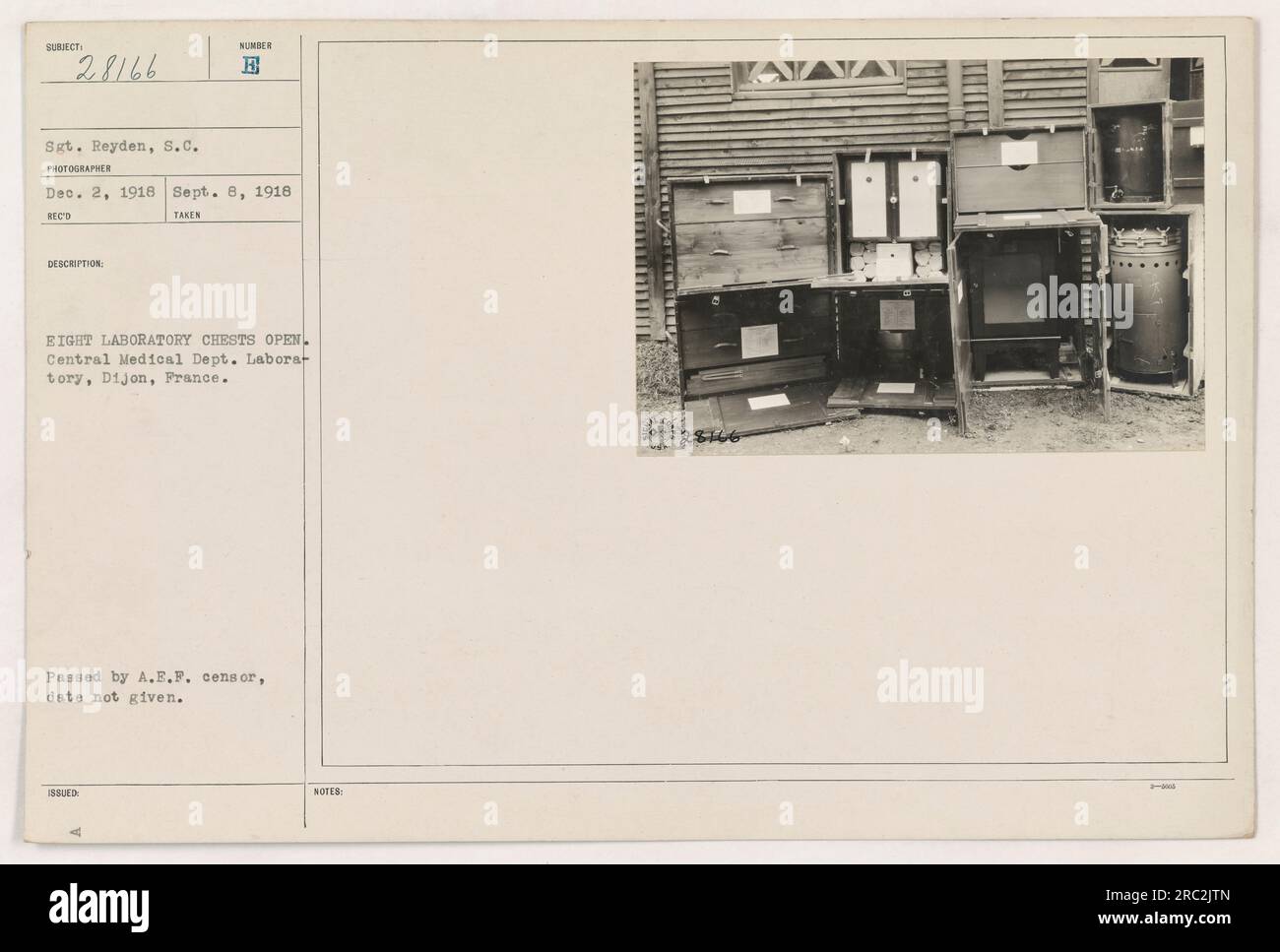 Sgt. Reyden stands in front of eight open laboratory chests at the ...