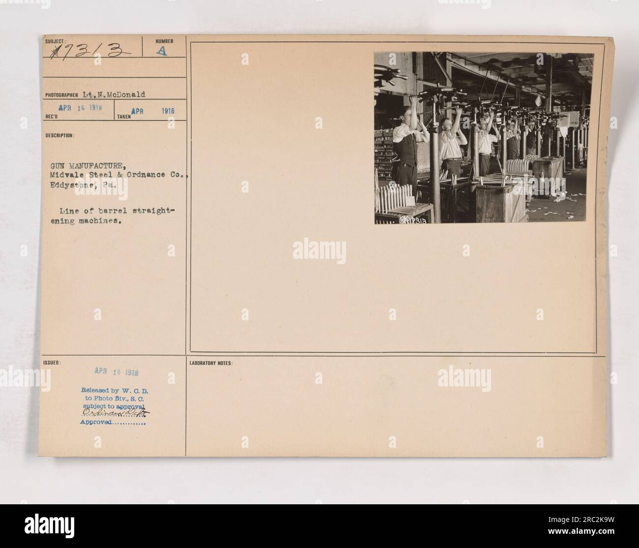 Photograph shows a line of barrel straightening machines at Midvale ...