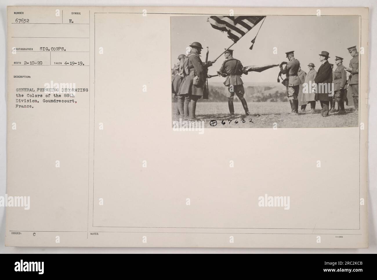 General Pershing is seen decorating the Colors of the 88th Division in ...