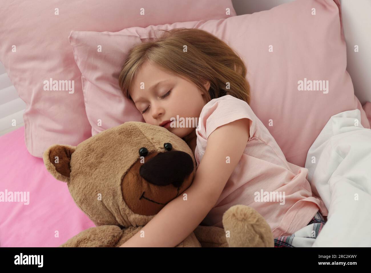 Little girl snoring while sleeping in bed Stock Photo - Alamy