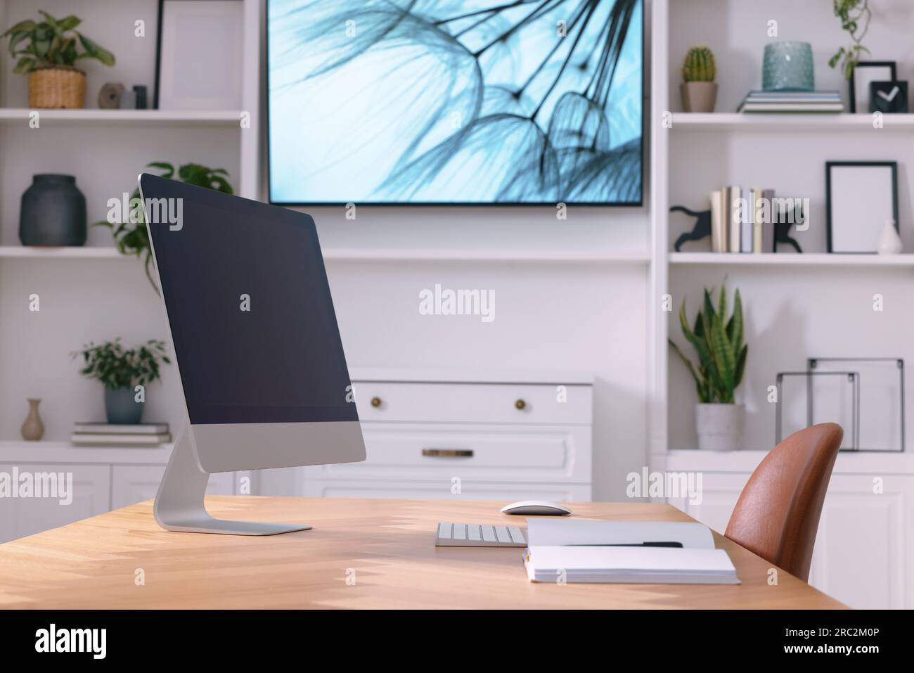Cosy workplace with computer near tv area. Interior design Stock Photo ...