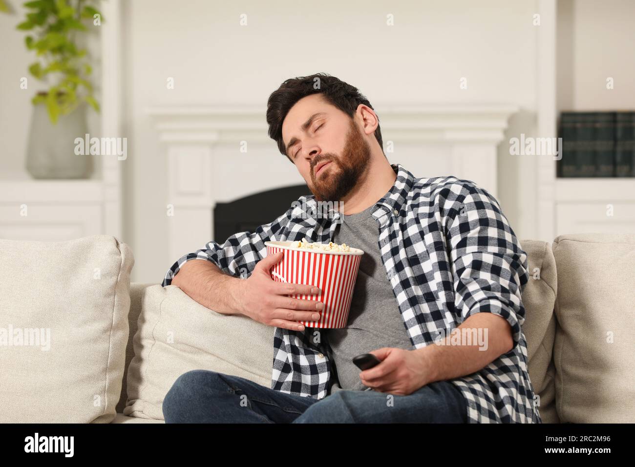 Man sleeping watching television hi-res stock photography and images ...