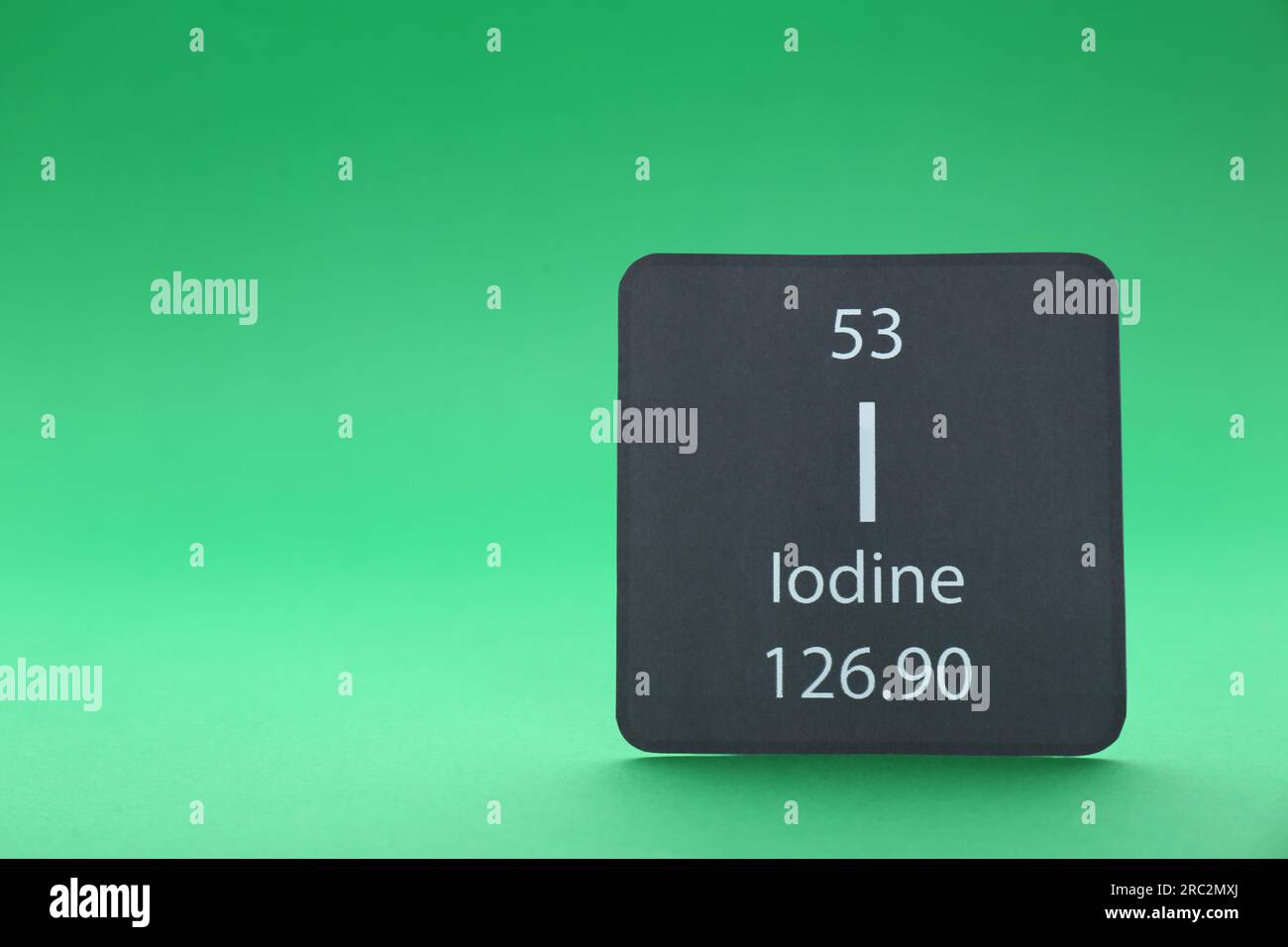 Card with iodine element on green background. Space for text Stock ...