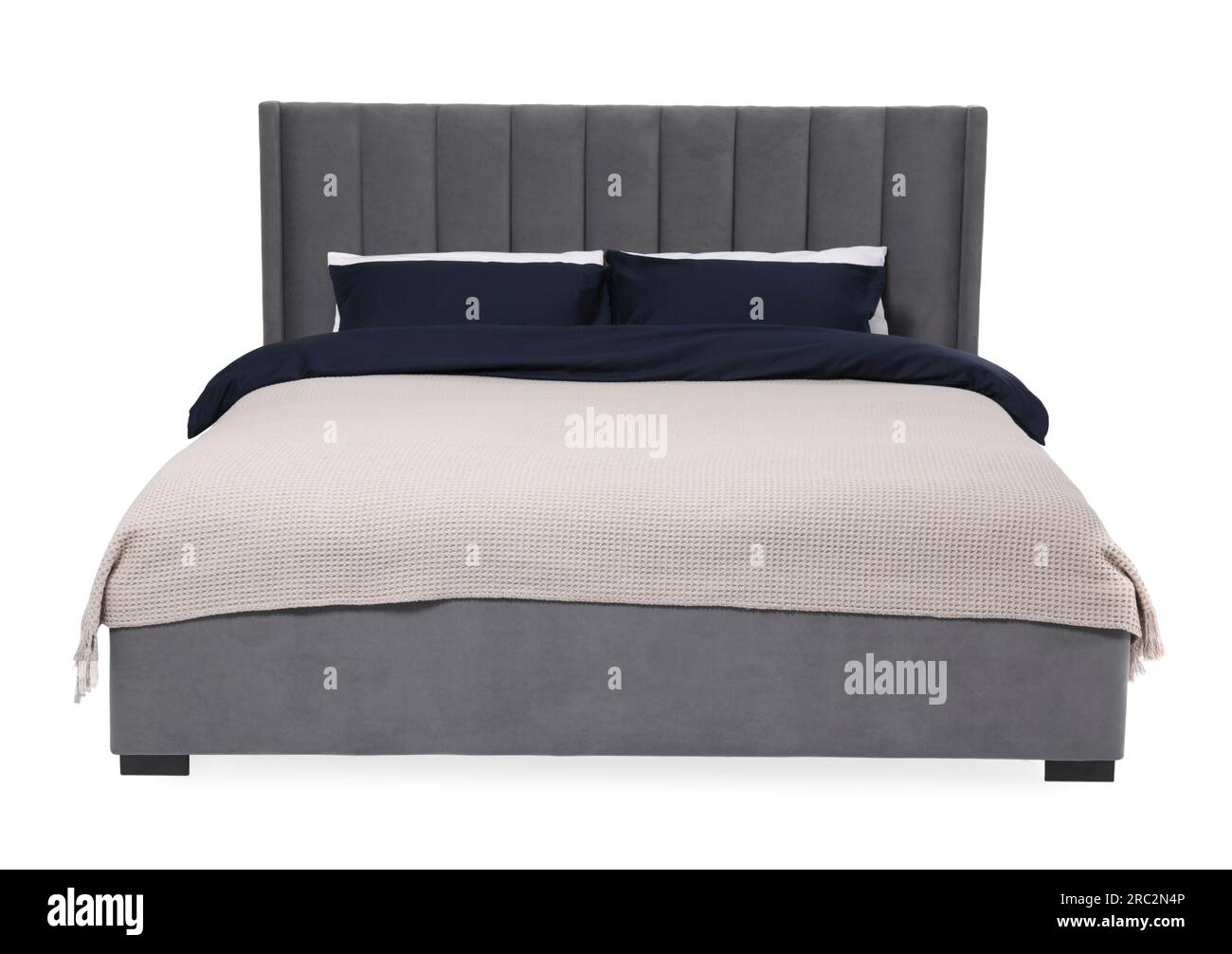 Comfortable gray bed with linens on white background Stock Photo - Alamy