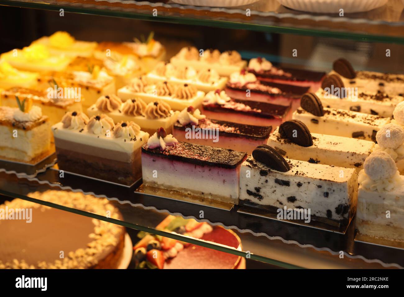 Different delicious cakes on counter in bakery shop, closeup Stock ...