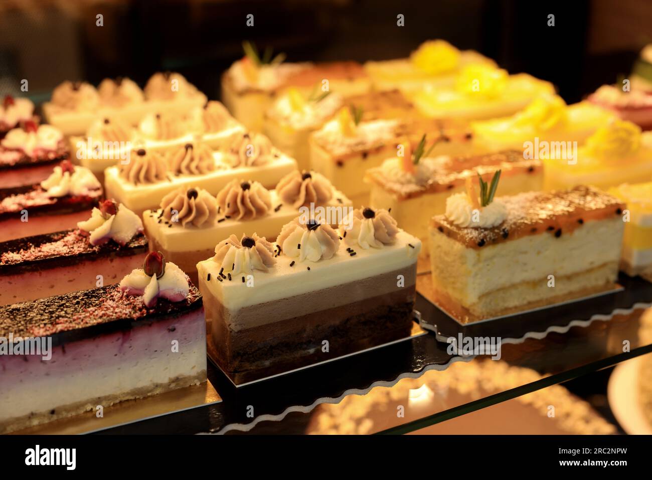 Different delicious cakes on counter in bakery shop, closeup Stock ...