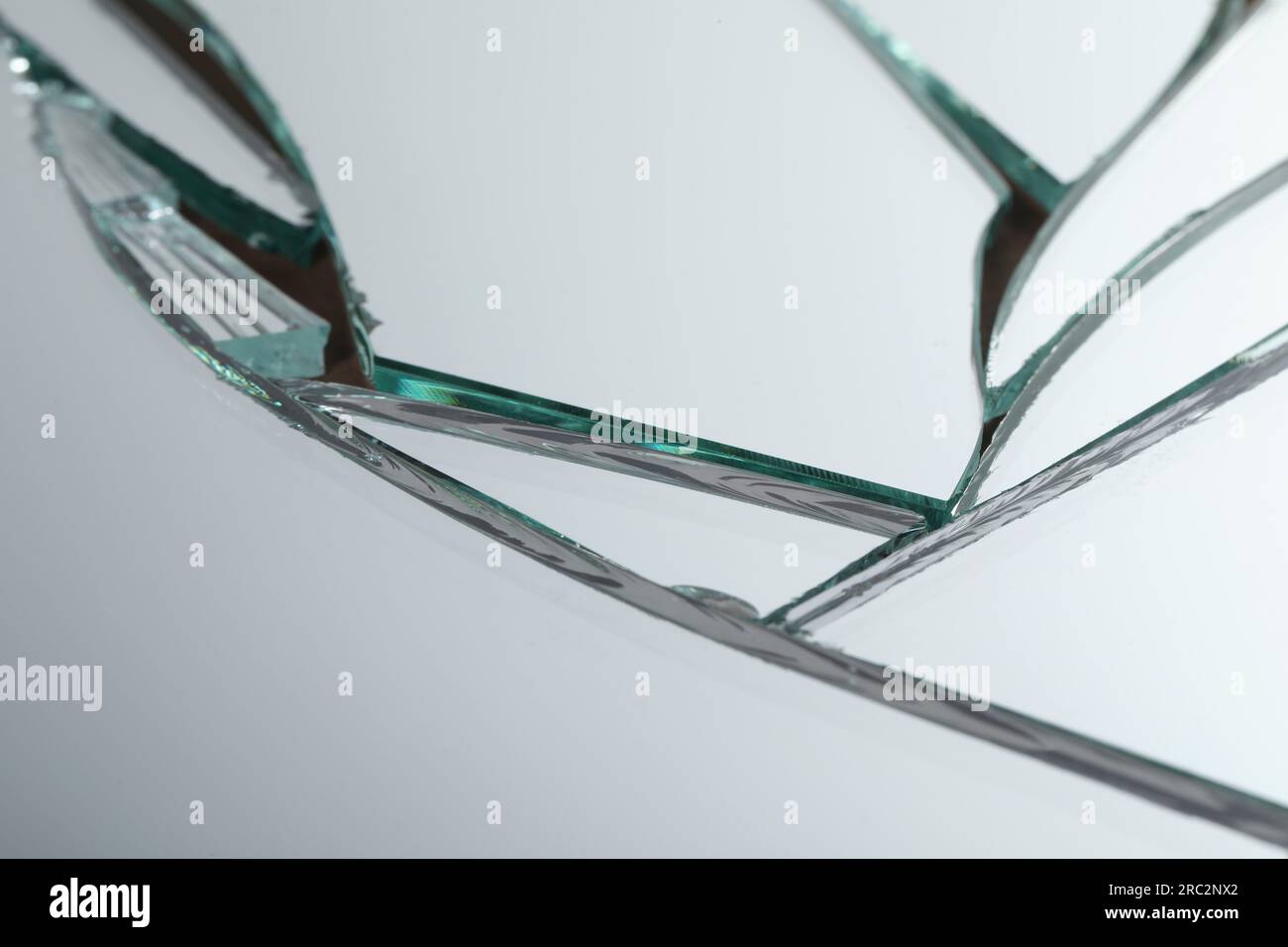 Broken mirror with many cracks as background, closeup view Stock Photo ...