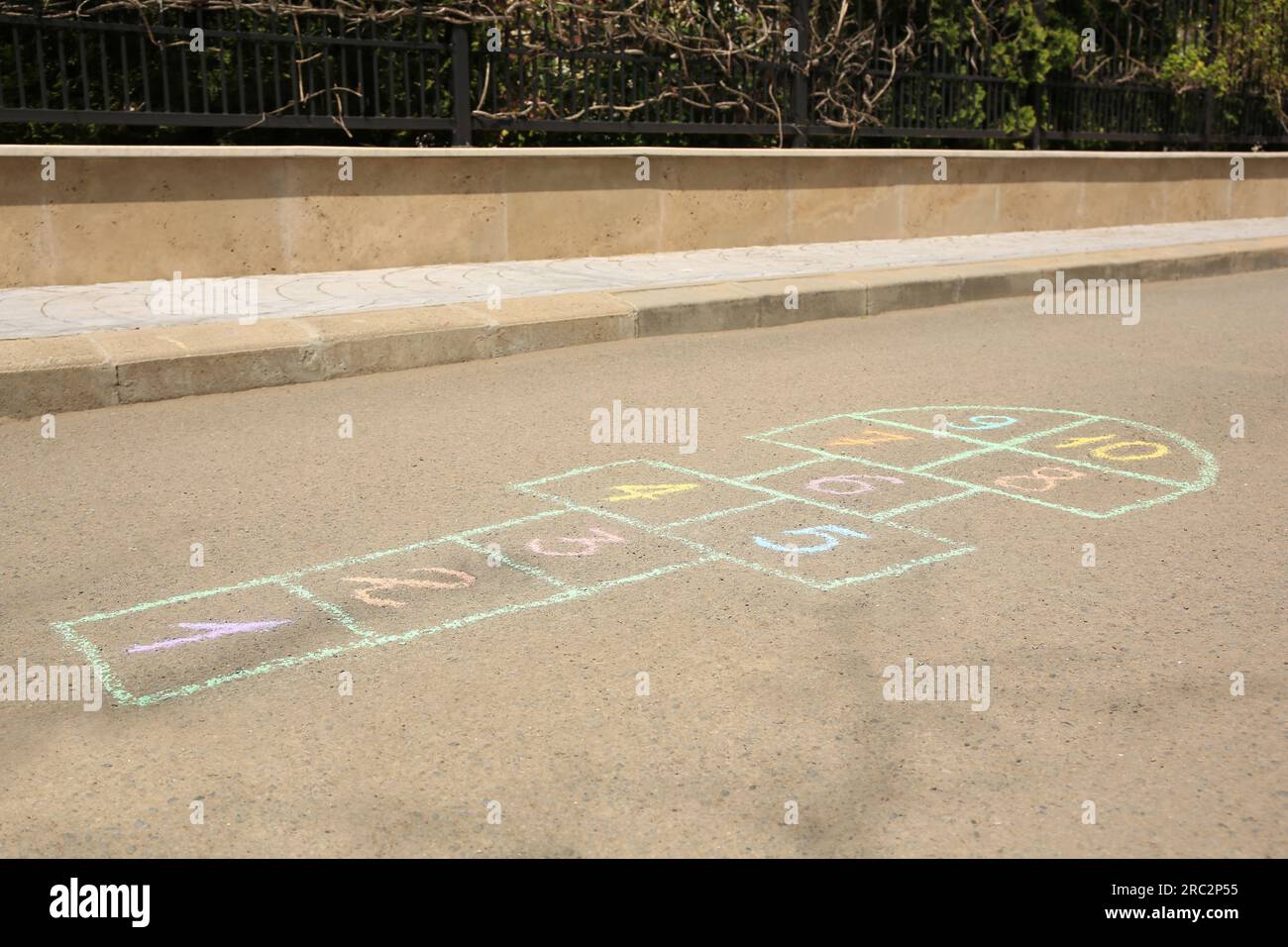 Hopscotch drawn with colorful chalk on asphalt outdoors Stock Photo - Alamy