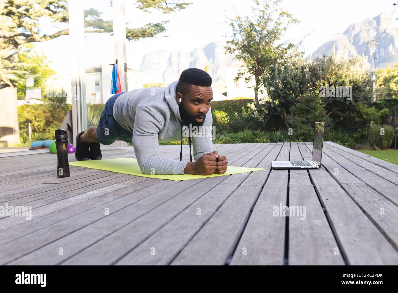 Focused athlete doing plank exercise hi-res stock photography and ...