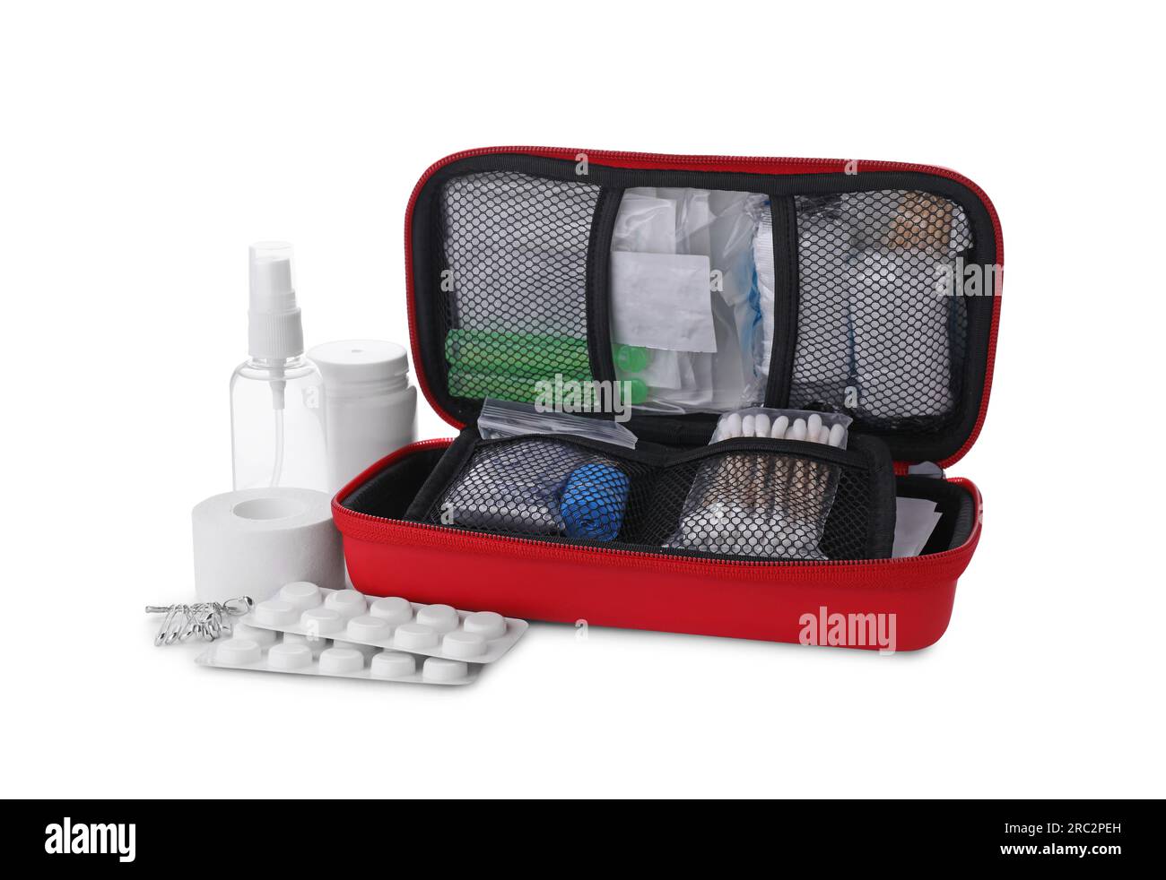 Red first aid kit with cotton buds, pins, pills, hand sanitizer and ...