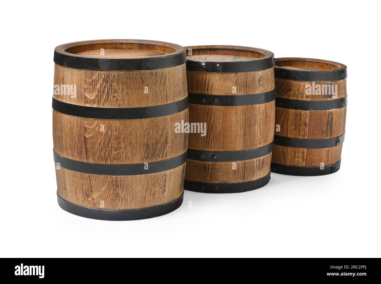 Three traditional wooden barrels on white background Stock Photo - Alamy