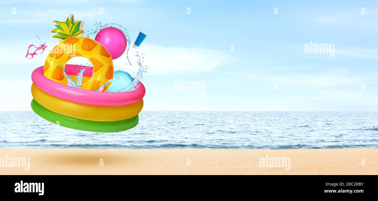 Beach accessories flying over sandy beach. Banner design with space for ...