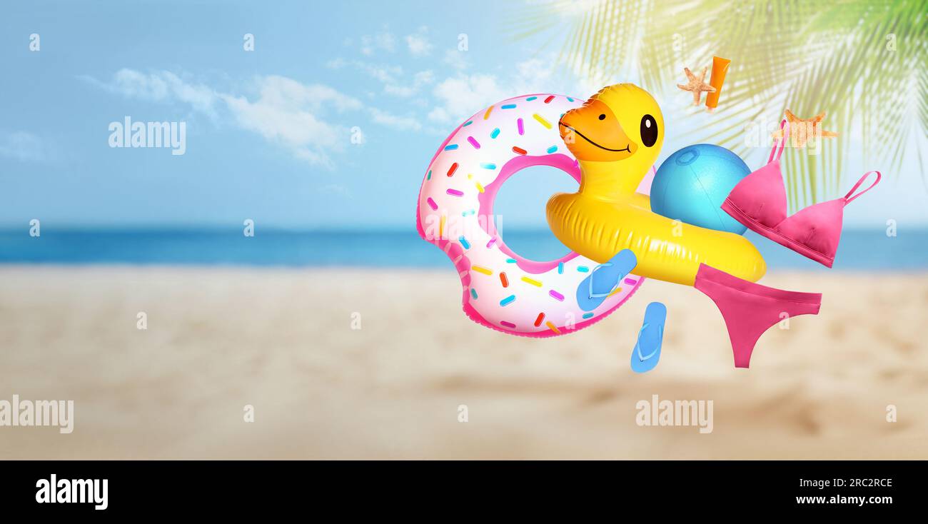 Sunscreen and beach accessories flying over sandy beach. Banner design ...
