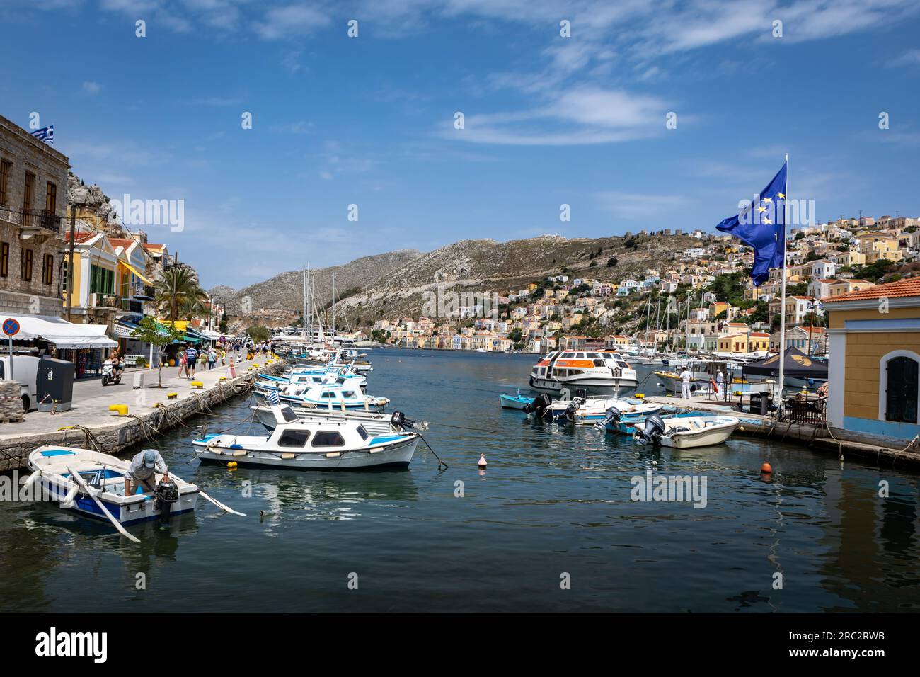 Symi, Greece - May 30, 2023: View to the harbour bay in Symi island ...