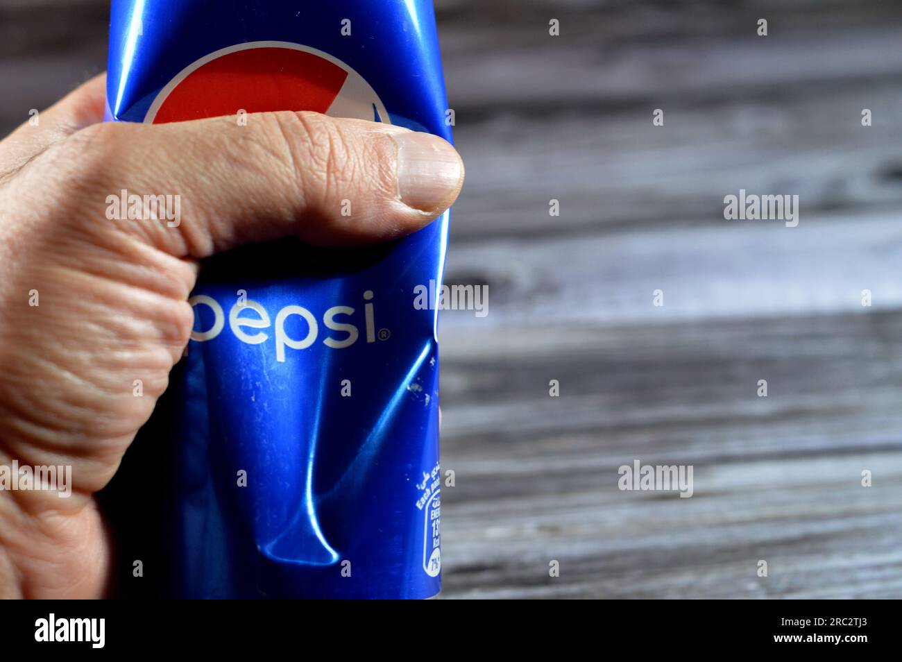 Cairo, Egypt, June 24 2023: Crushed Pepsi can, Cola flavor plastic ...