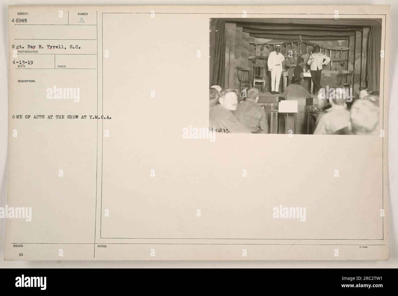 Soldiers enjoy a Y.M.C.A. show during World War One, photographed by ...