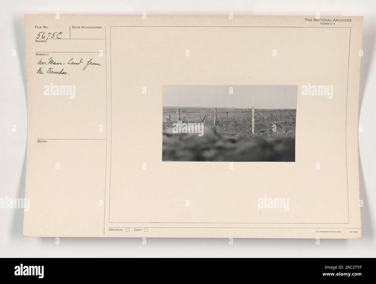 Soldiers manning a machine gun in the trenches during World War I. The ...