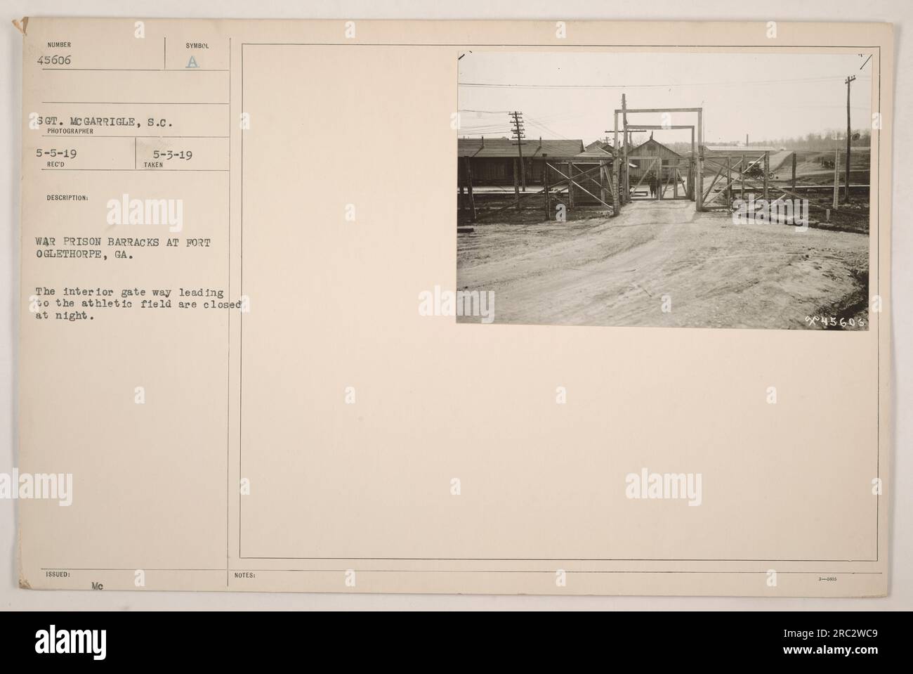 Interior gate leading to the athletic field at the war prison barracks ...