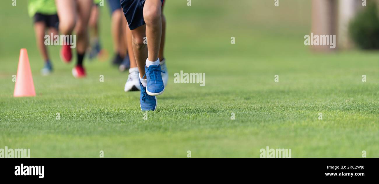 Running children, young athletes run in a kids run race, running on ...