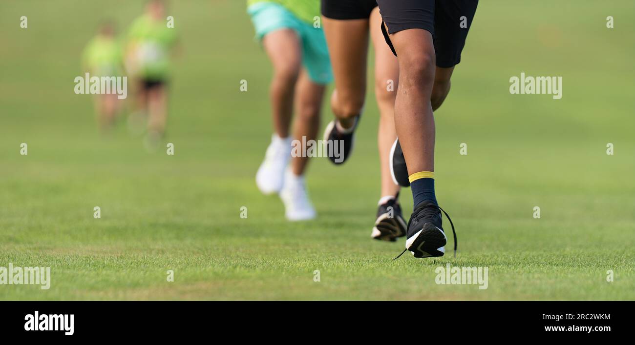 Running children, young athletes run in a kids run race, running on ...