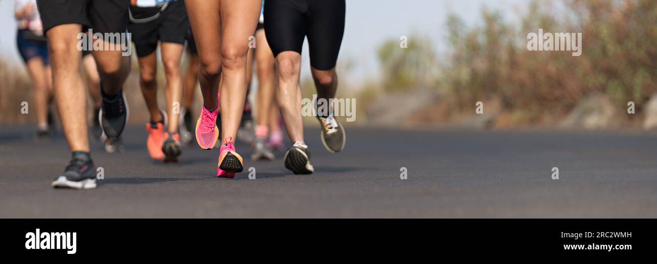 Marathon running race, people feet on city road Stock Photo - Alamy