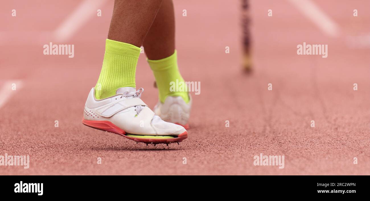Pole vaulter prepares for jump, detail of sports shoes spikes Stock ...