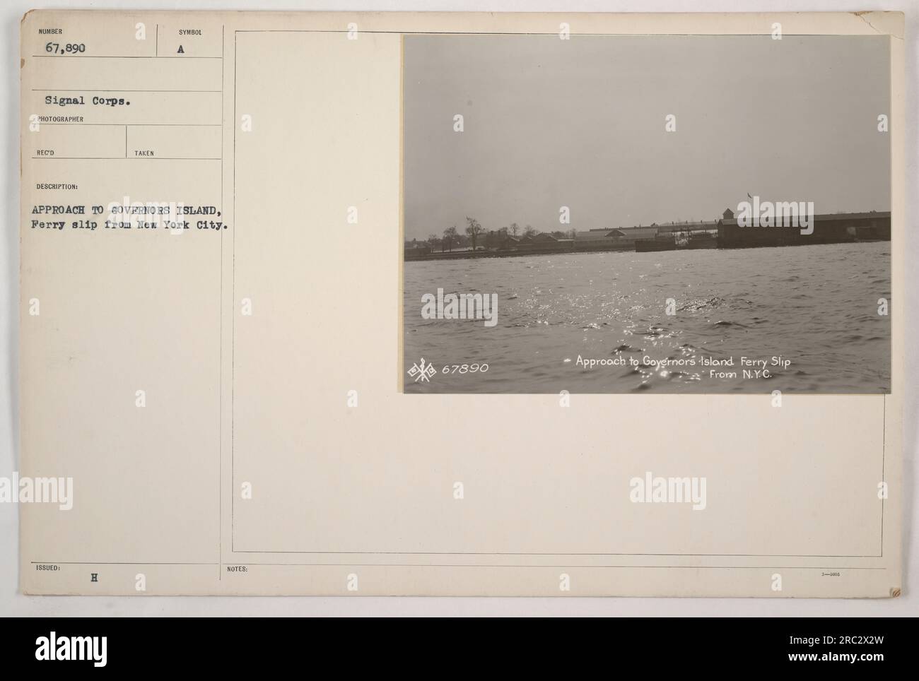 The photograph shows the approach to Governors Island from a ferry slip ...